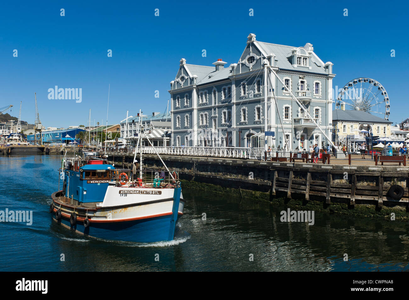 Fishing cutter and African Trading Port building at V&A Waterfront ...