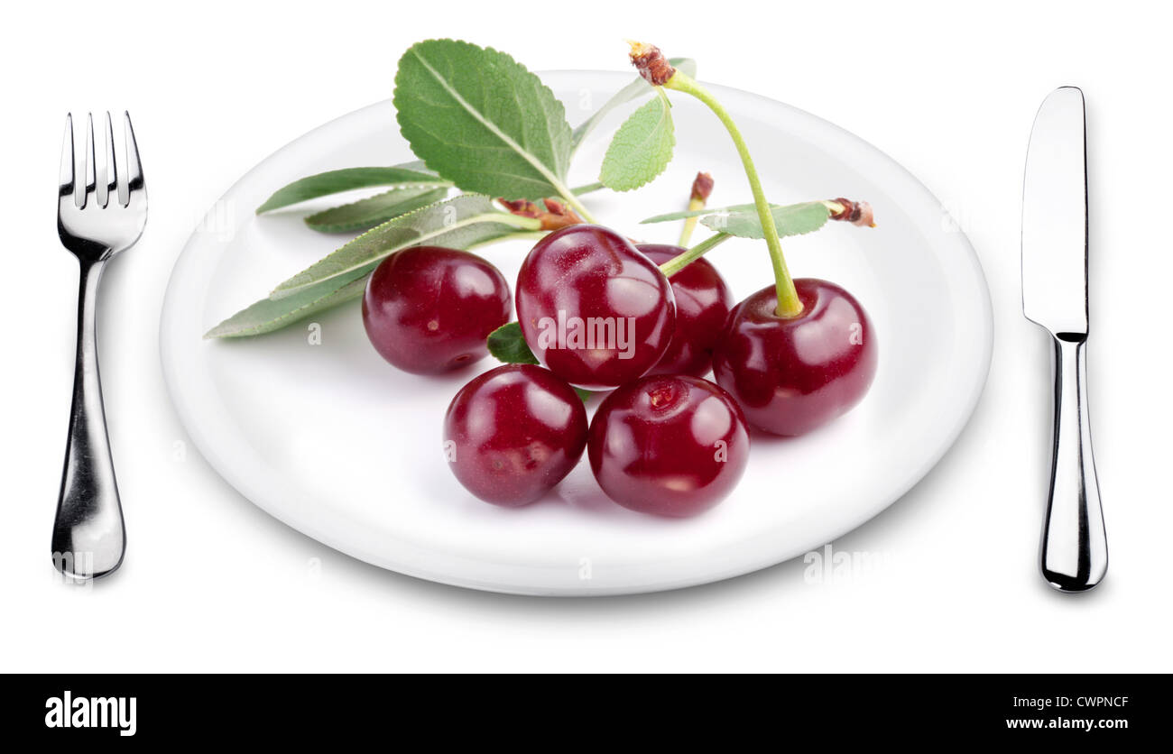 Cherries on a plate. White background Stock Photo - Alamy