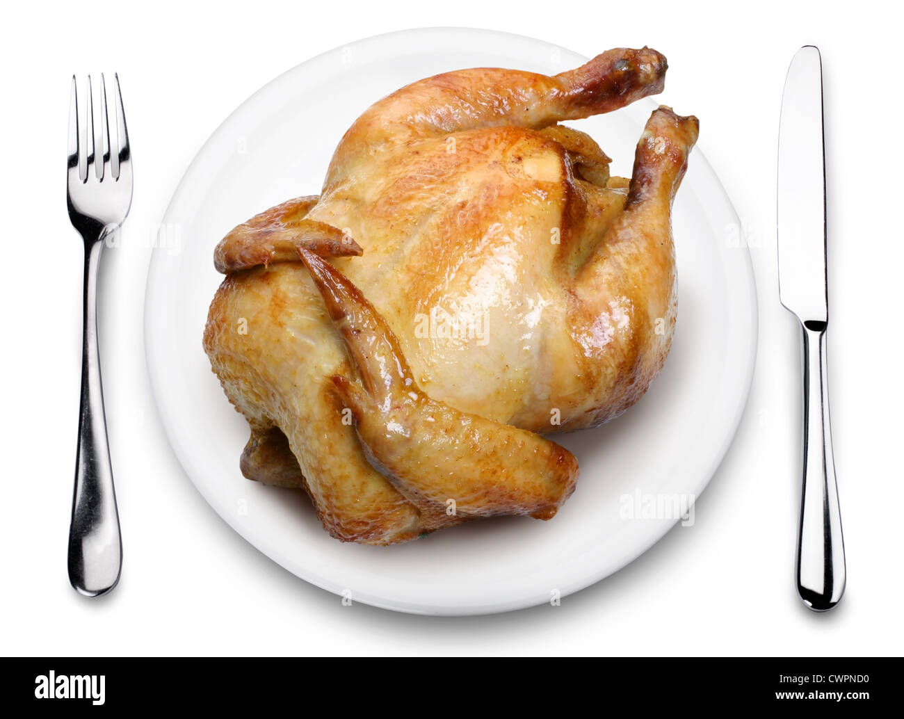 Roast chicken on a plate. View from above on a white background Stock ...
