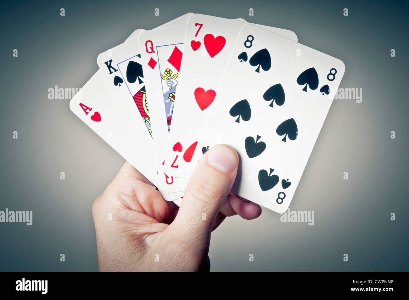 man holding playing cards hand Stock Photo - Alamy