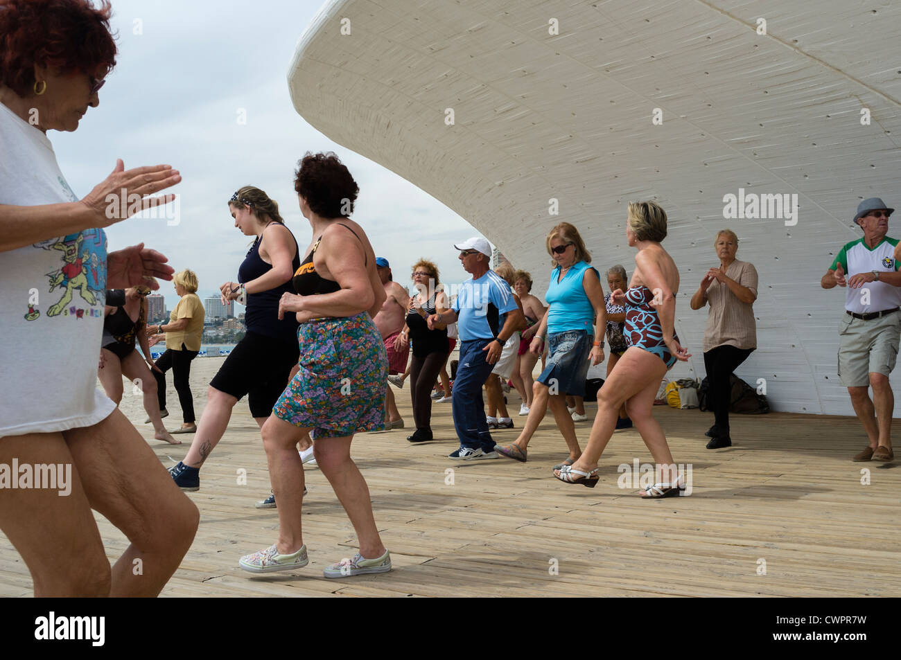 Pensioners do the samba on the wooden promenade at Benidorm's Poniente ...