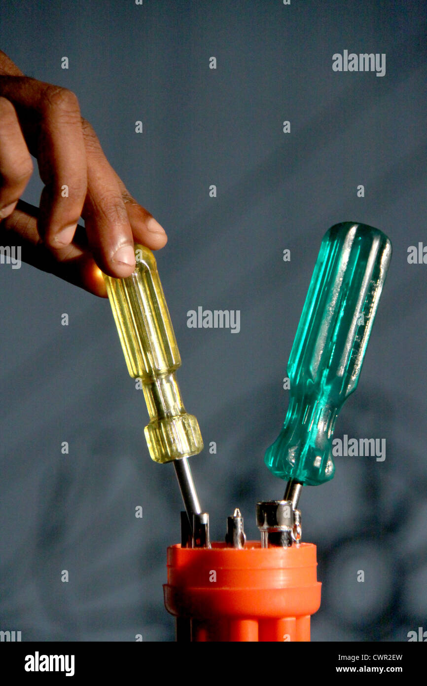 Man picking screwdriver Stock Photo - Alamy