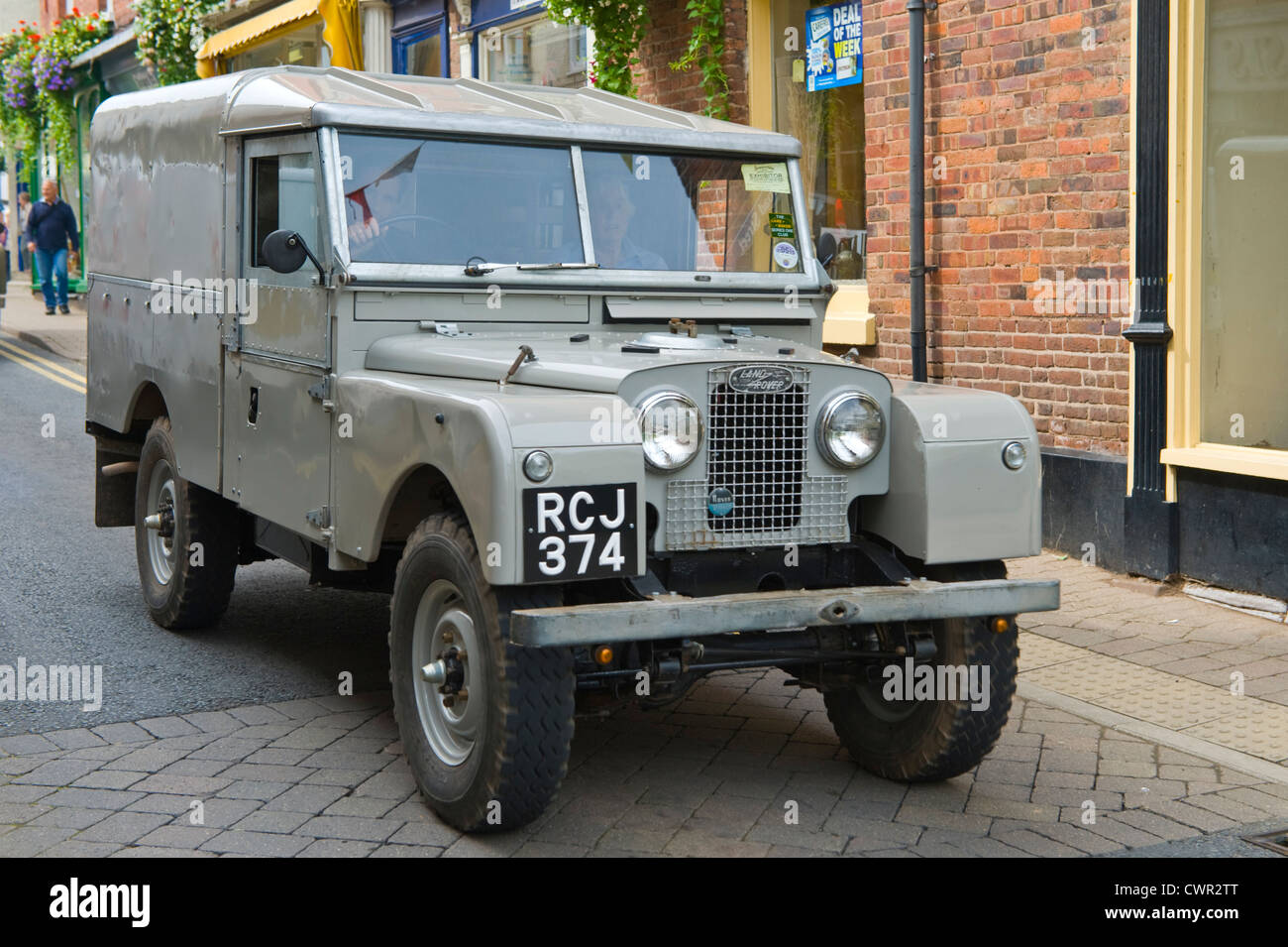 Old Land Rover in parade of vintage cars at opening of Bromyard Hop ...
