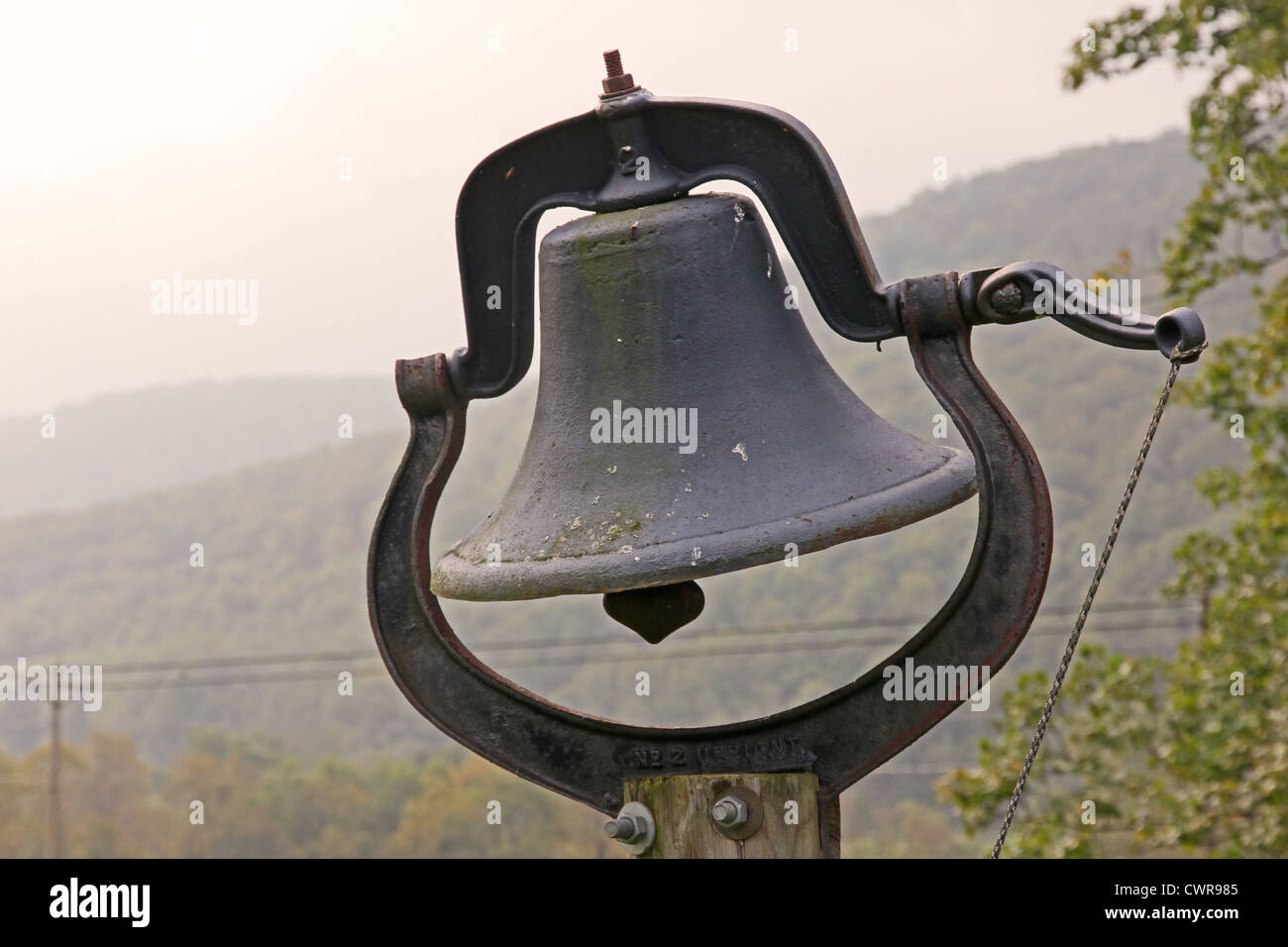 A bell on a post waiting to be rung Stock Photo - Alamy