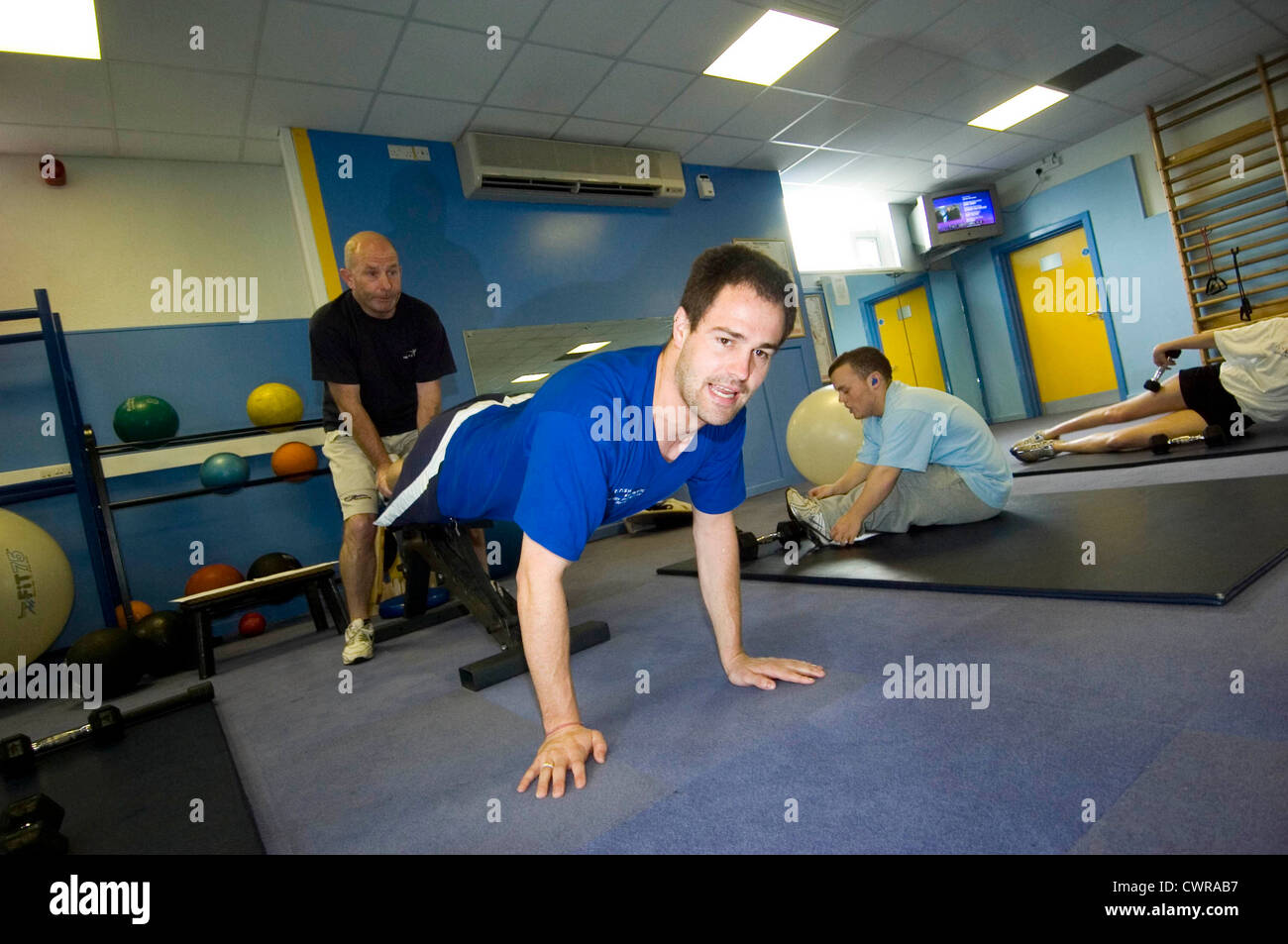 Swimming Coach Billy Pye training Paralympian swimmer David Roberts CBE ...