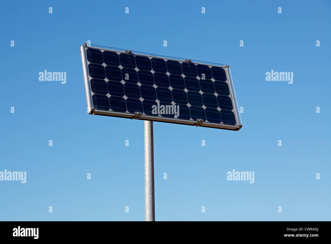 Solar panel with solar modules on a hot, sunny summer day with a blue ...