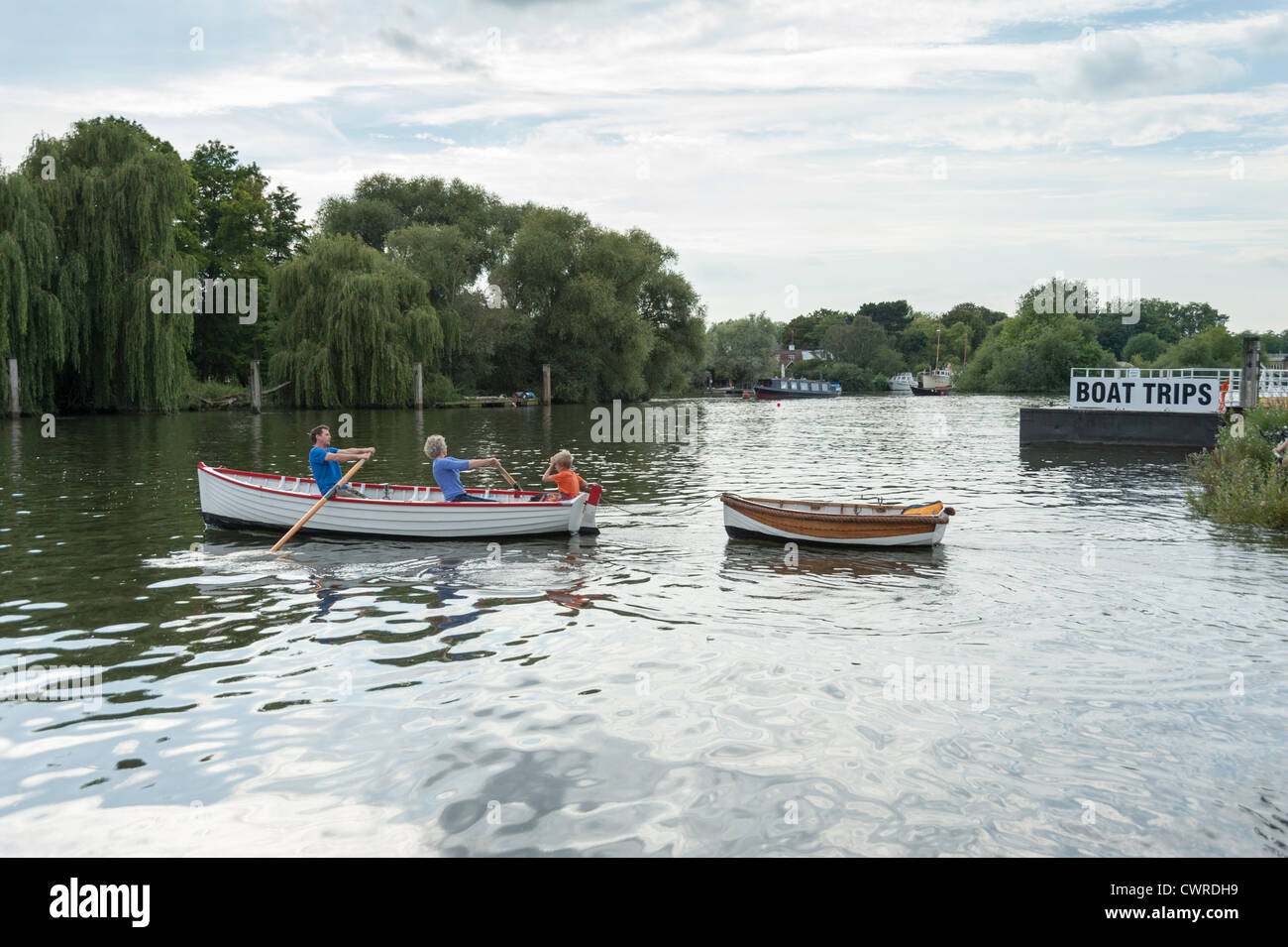 Family rowing a boat on the River Thames at Richmond upon Thames Surrey ...
