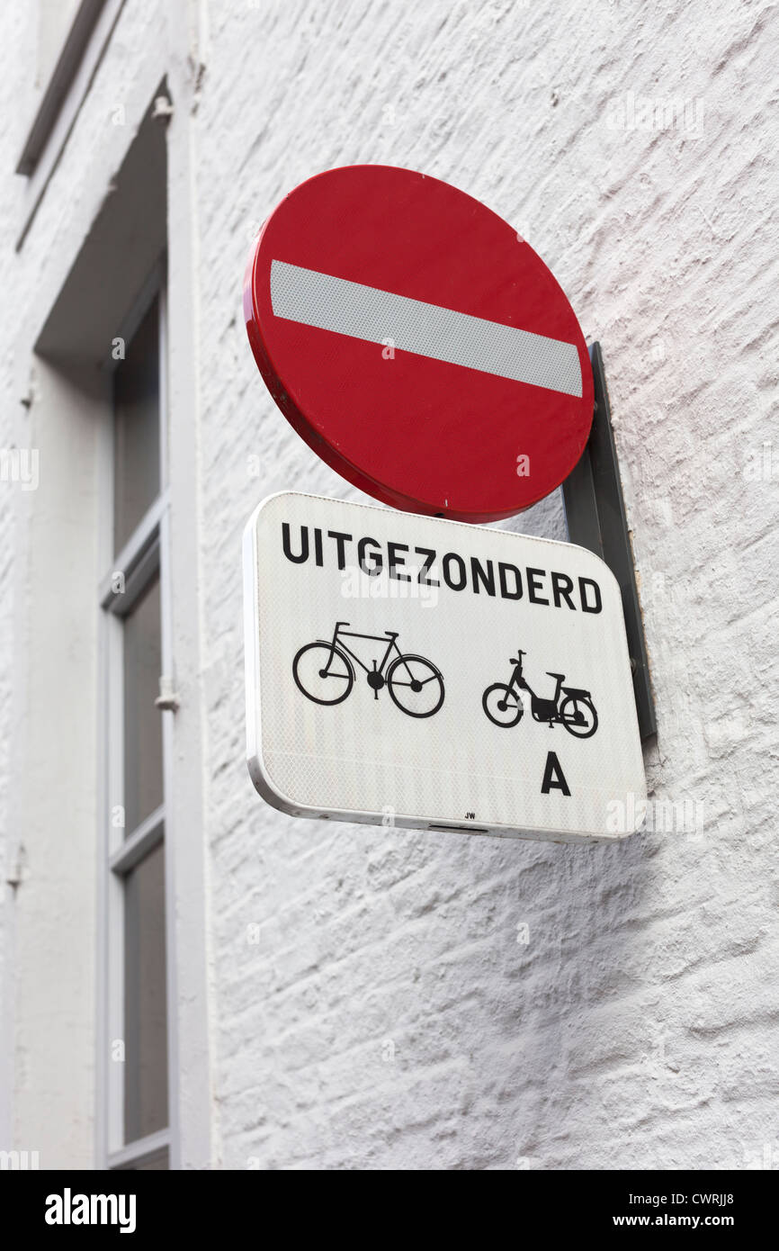 No entry sign in Bruges, Belgium, with Dutch word for 'except ...