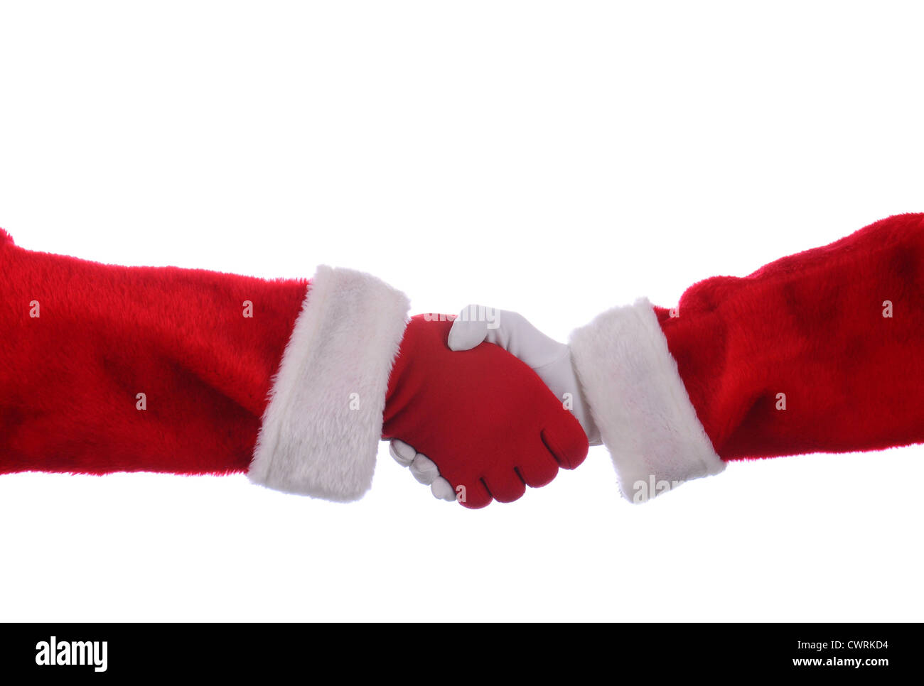 Two Santa Claus' shaking hands over a white background. One Hand is in ...