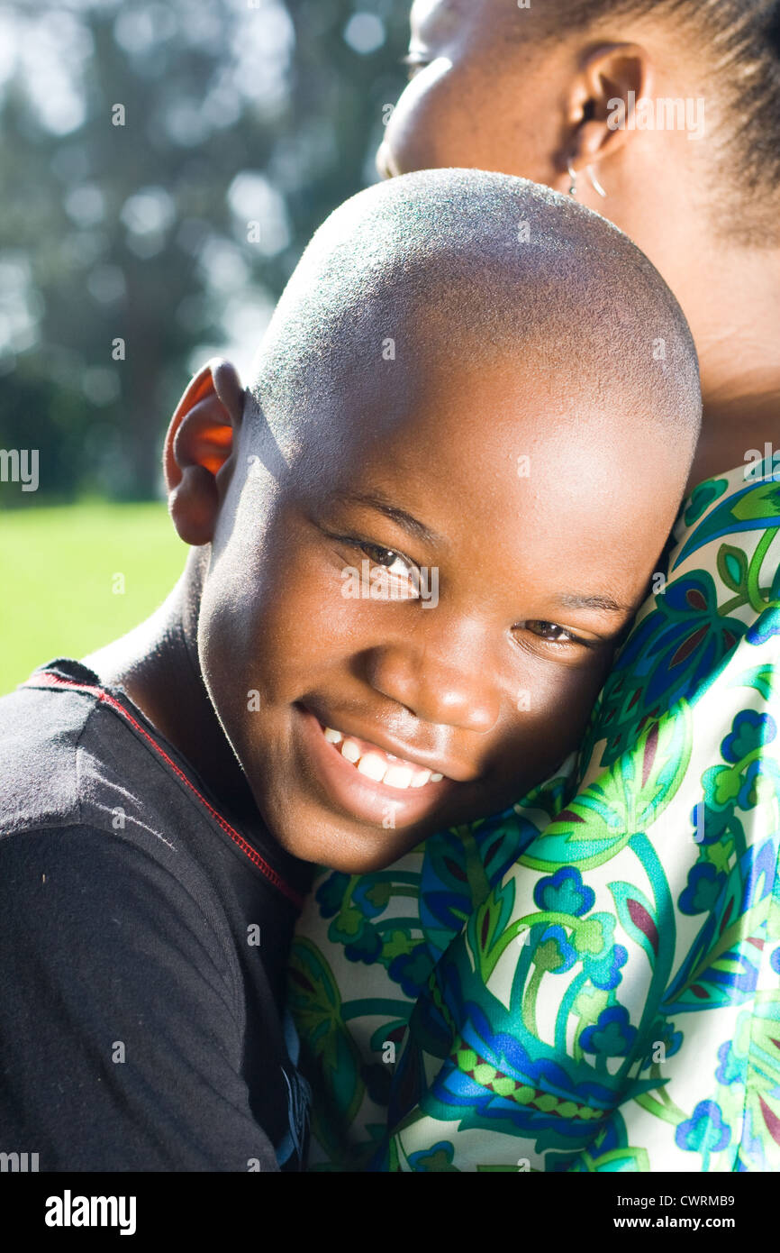 cute african american boy hugging mother Stock Photo - Alamy