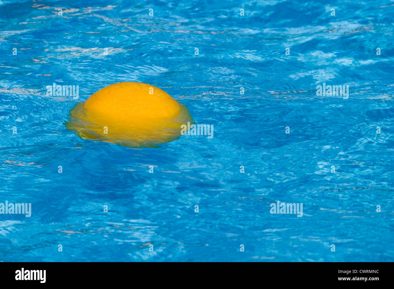 yellow ball in the swimming pool Stock Photo - Alamy