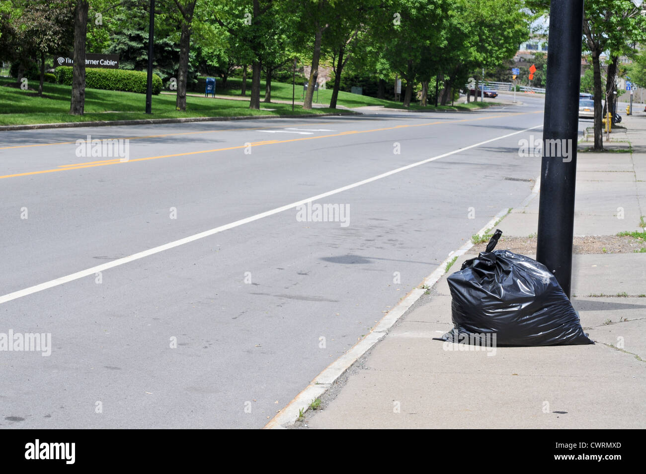 Bagged trash ready for municipal pick-up Stock Photo - Alamy