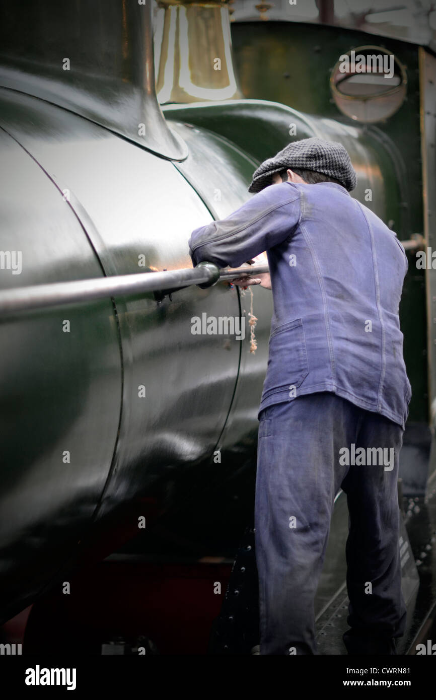 worker on steam train Stock Photo - Alamy