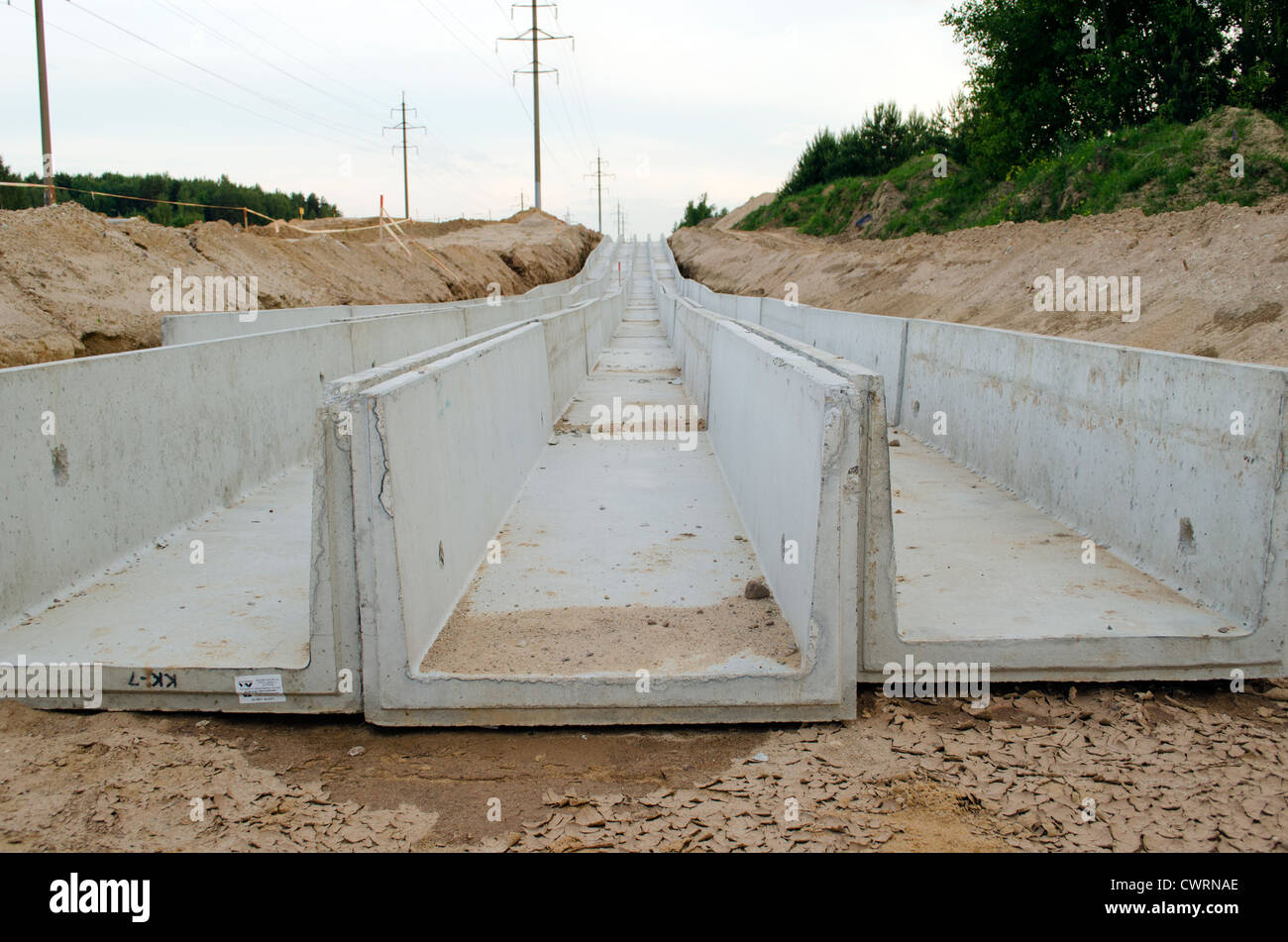 Concrete moats prepared for electrical and communications lay ...