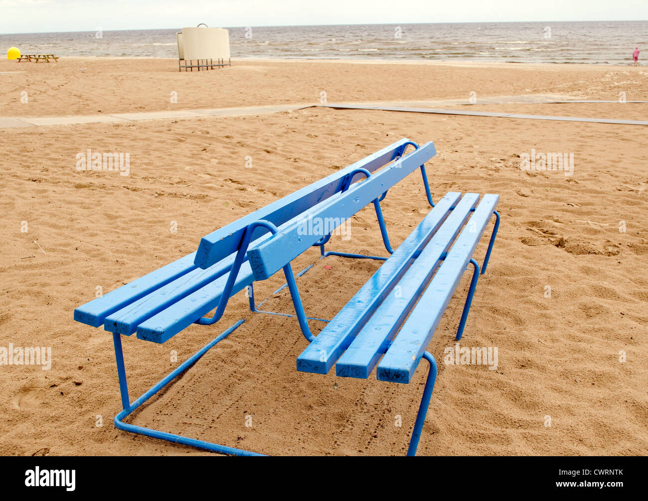 Blue bench on seaside sand after rain. Bathing box in beach Stock Photo ...
