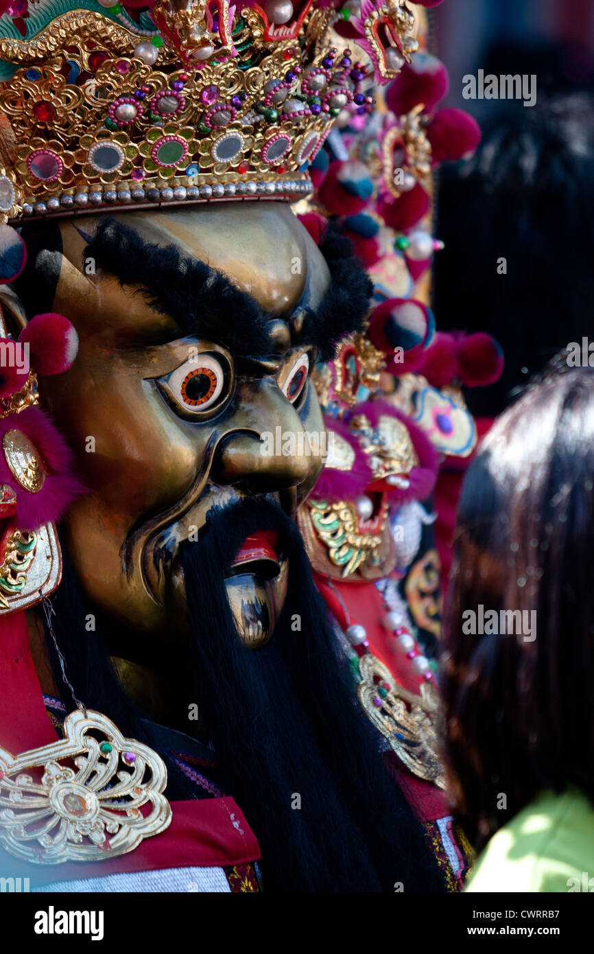 A wooden mask of a god at the "Pigs of God" festival in Sanxia near ...