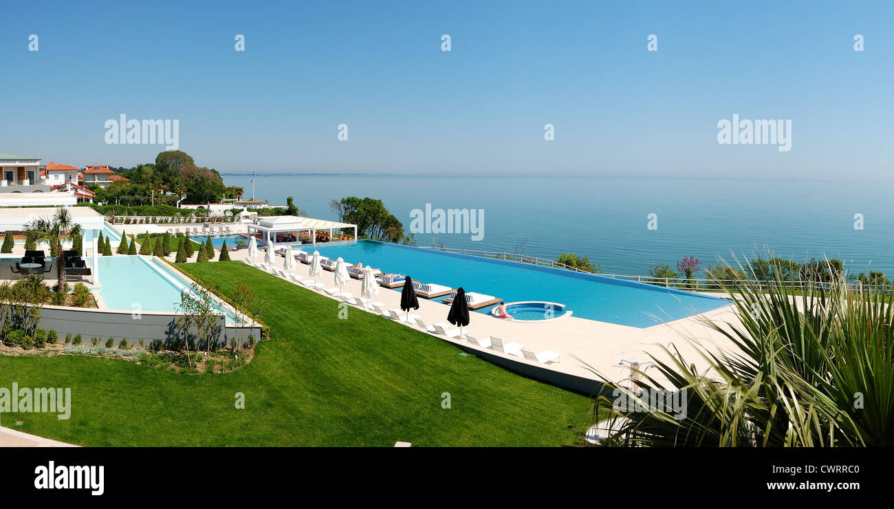 Panorama of infinity swimming pool by beach at the modern luxury hotel ...