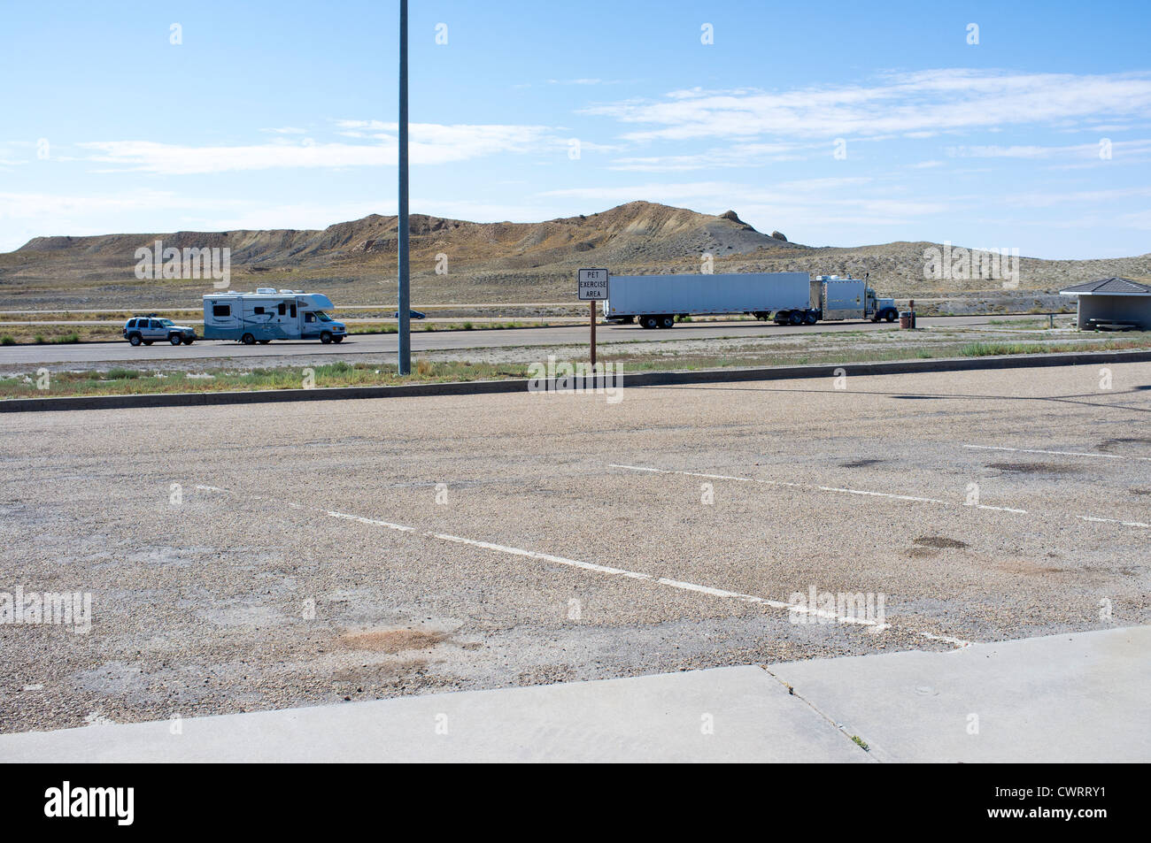 A semi and a RV are parked at a desert rest stop in Utah Stock Photo ...
