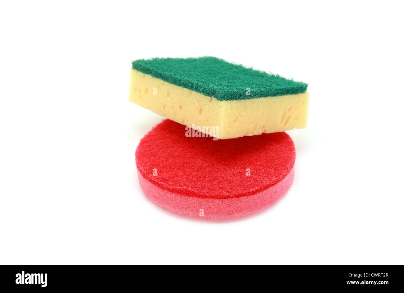 red and yellow kitchen sponges on white background Stock Photo - Alamy
