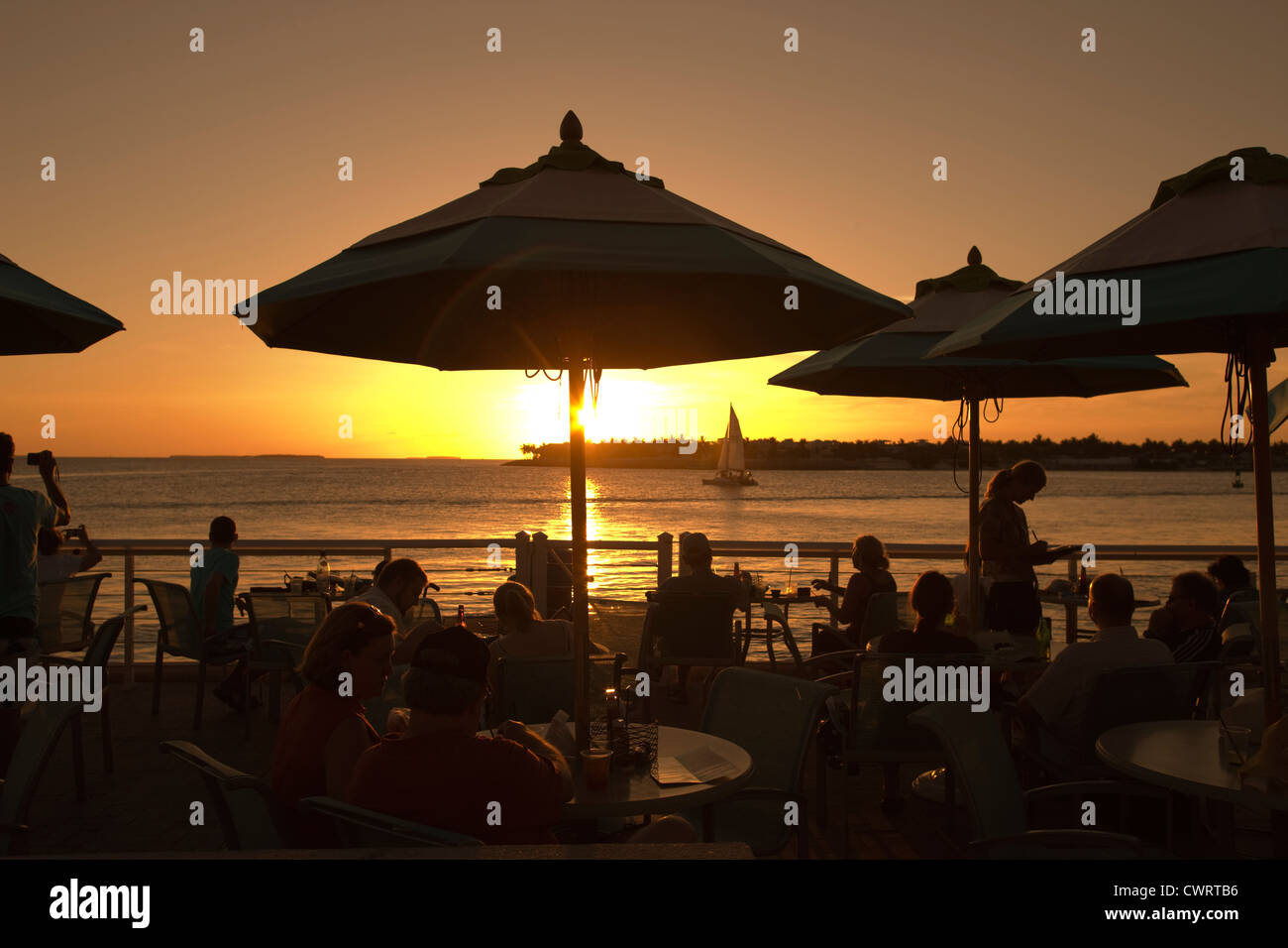 TOURISTS WATCHING SUNSET WESTIN HOTEL MALLORY SQUARE OLD TOWN HISTORIC ...