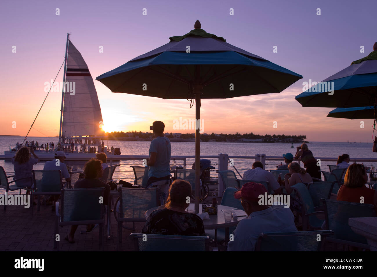 TOURISTS WATCHING SUNSET WESTIN HOTEL MALLORY SQUARE OLD TOWN HISTORIC ...