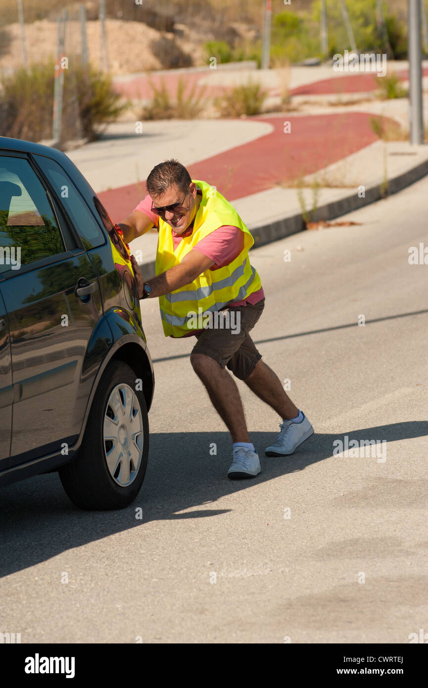 Pushing a car uphill hi-res stock photography and images - Alamy