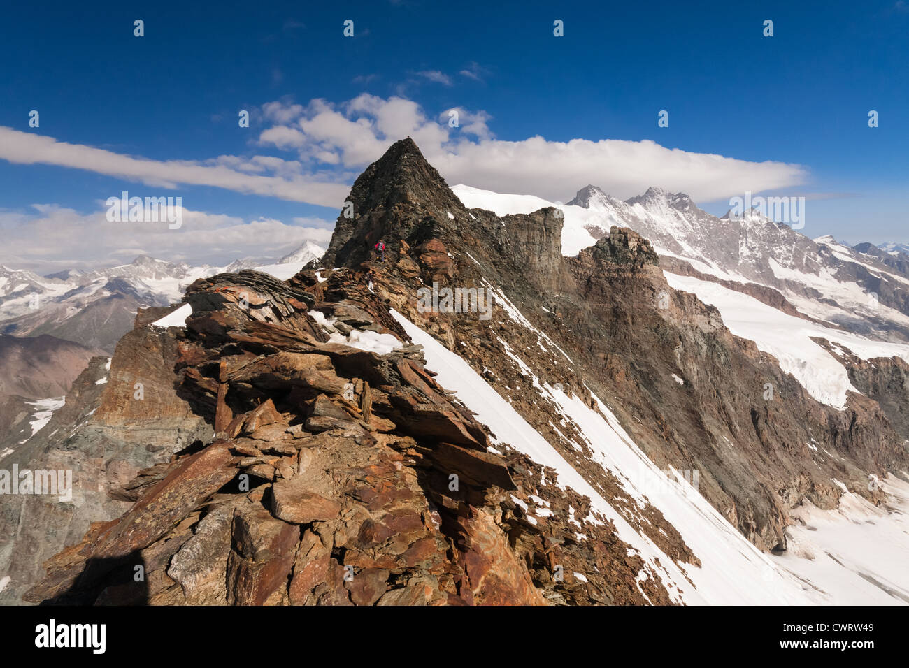 Two climbers can be seen in the distance traversing the loose knife ...