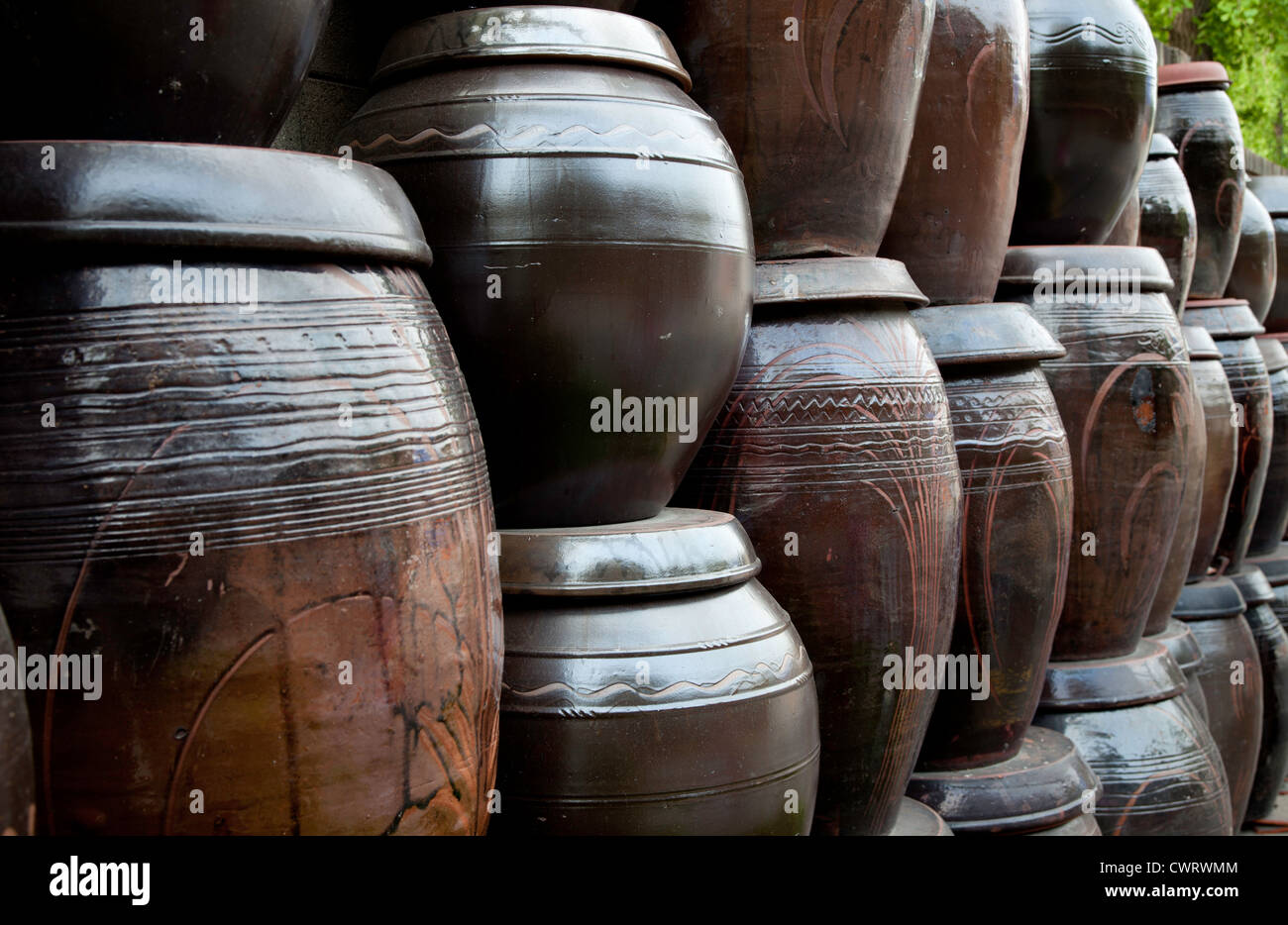Stacks of Korean Kimchi jars along a wall Stock Photo - Alamy
