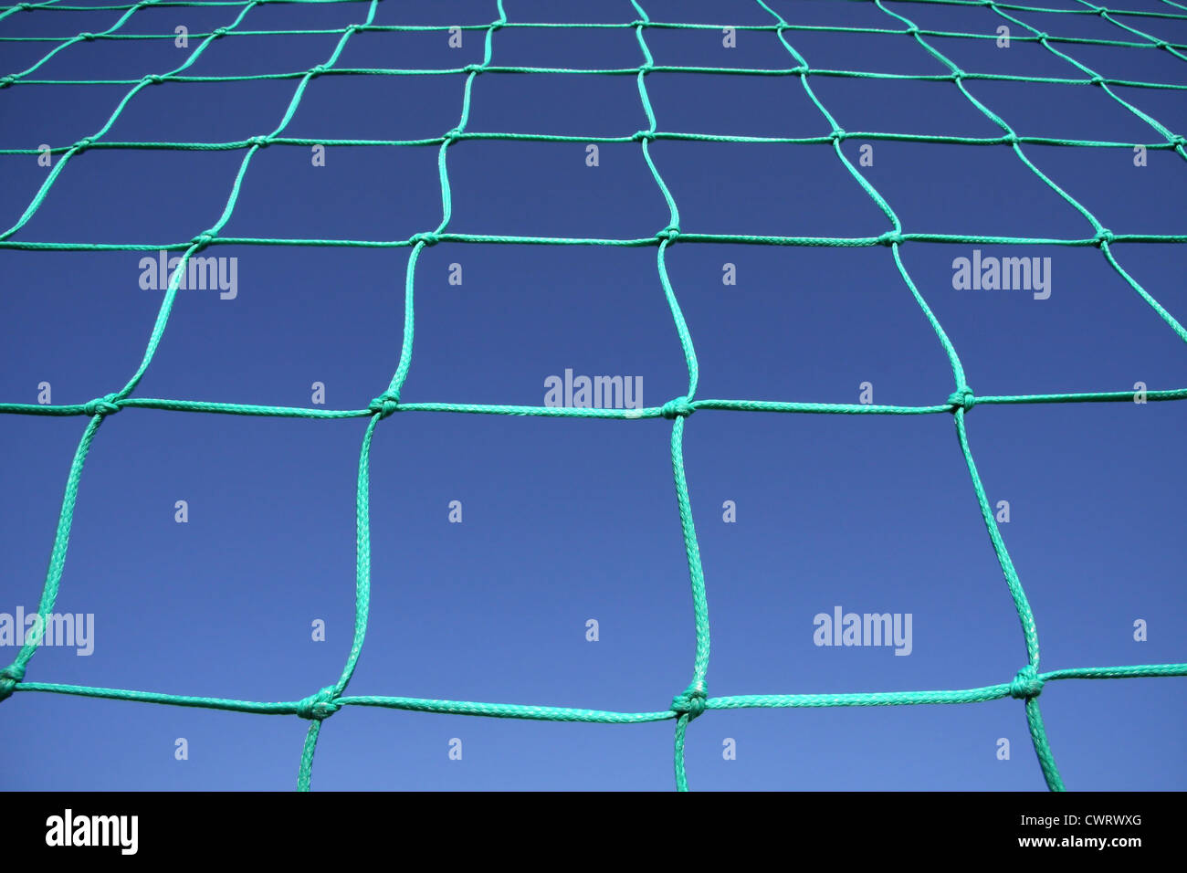A green goal net isolted on a blue sky Stock Photo - Alamy