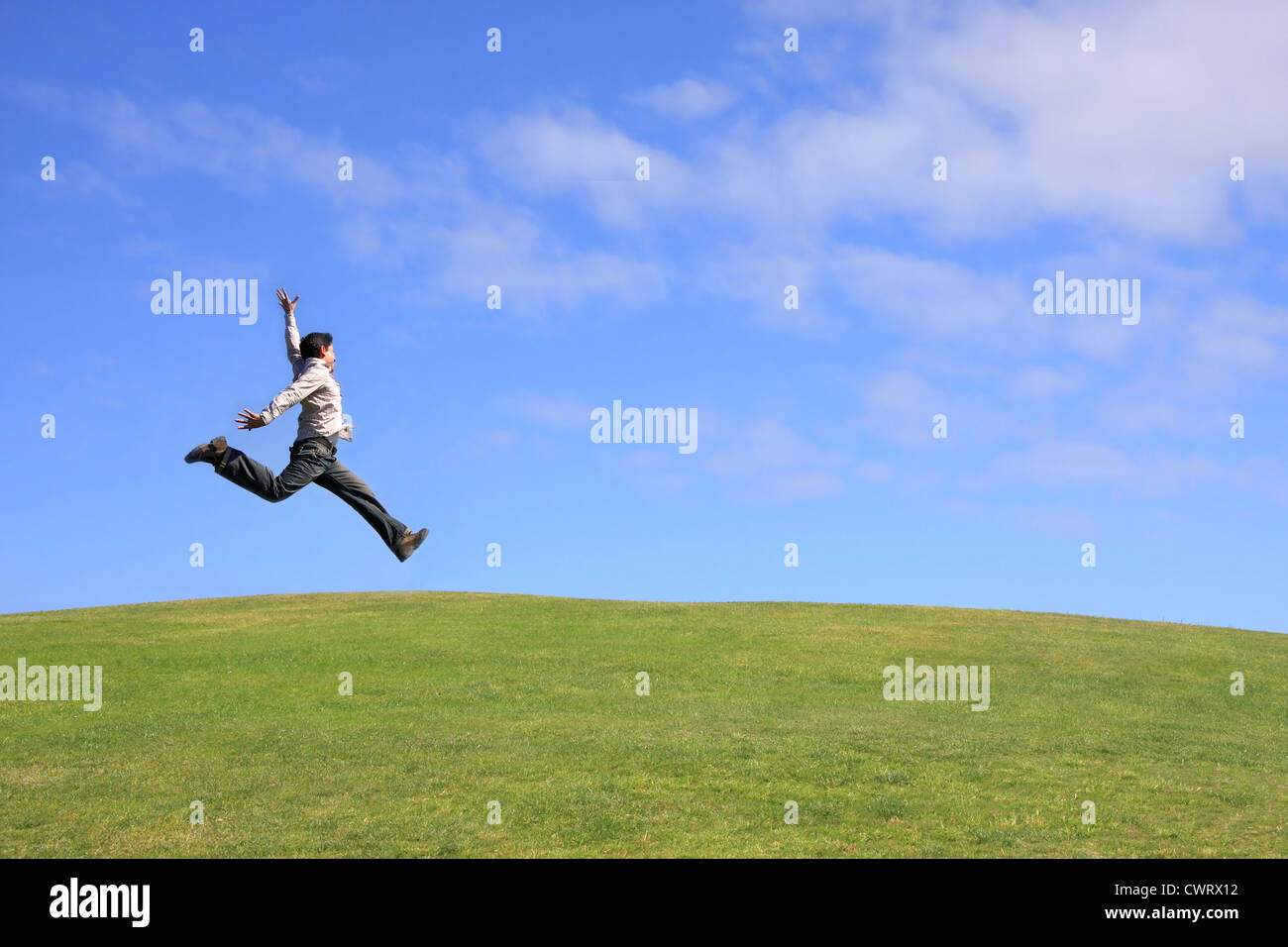 Happy man jumping on a beautiful landscape Stock Photo - Alamy