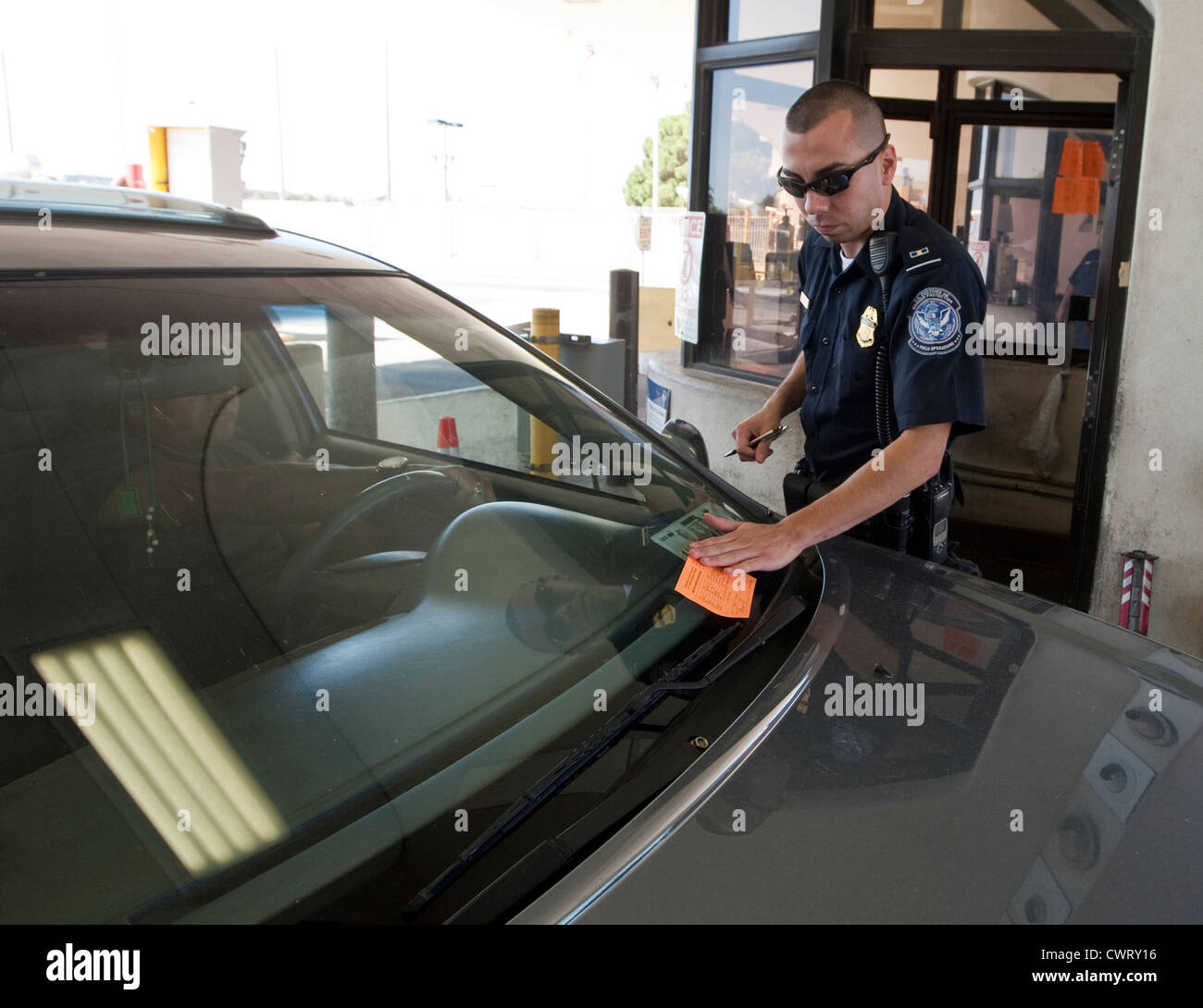 U.S Customs and Border Protection inspect cars, ask for documentation ...