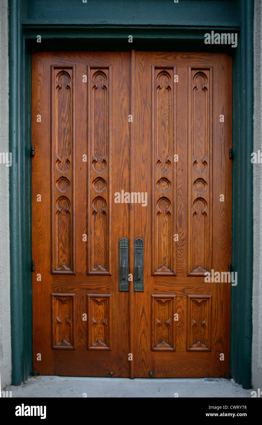 Large deep, rich colored, wooded double doors with dark teal trim Stock ...