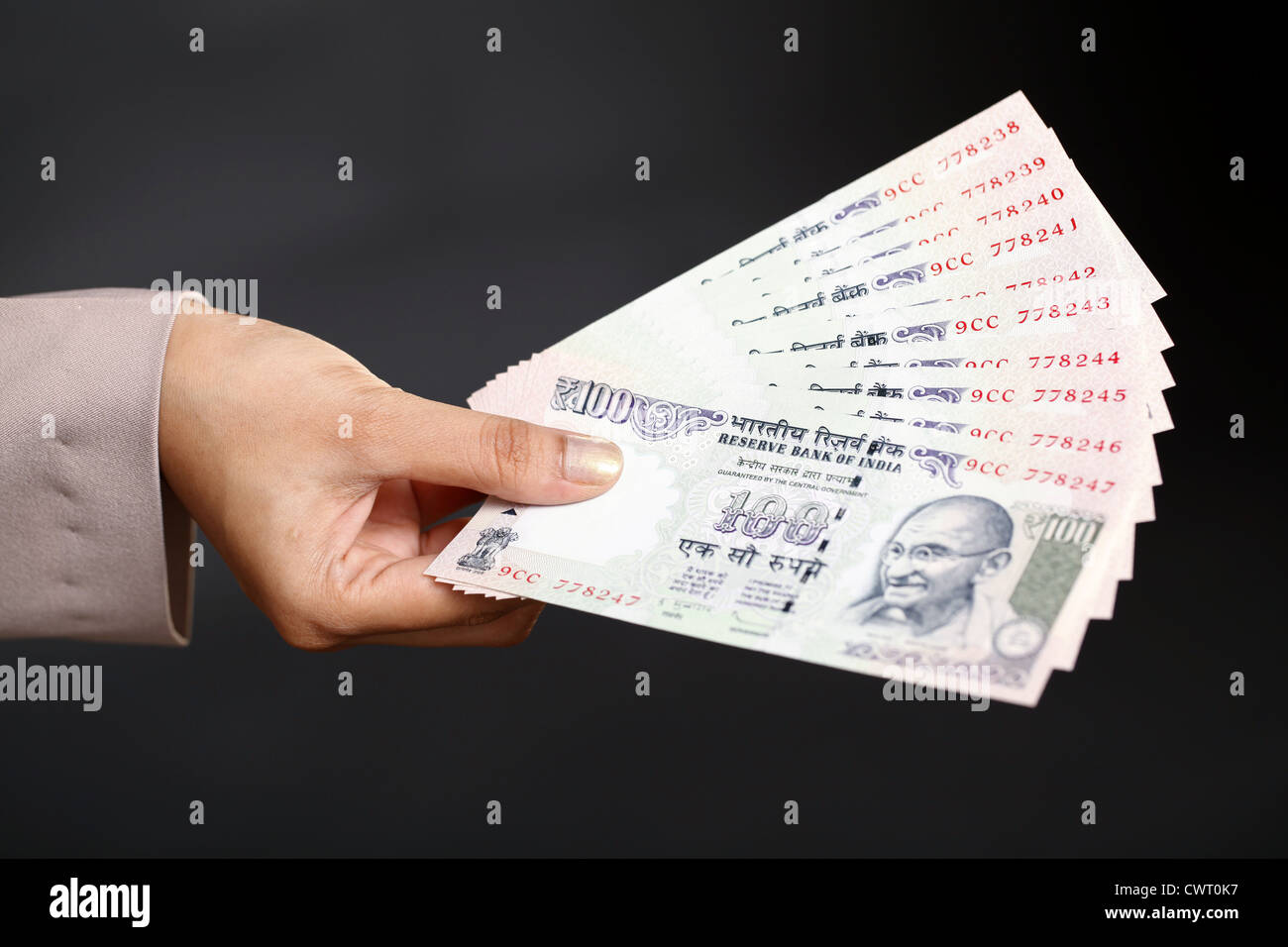 Hand holding indian rupee notes hi-res stock photography and images - Alamy
