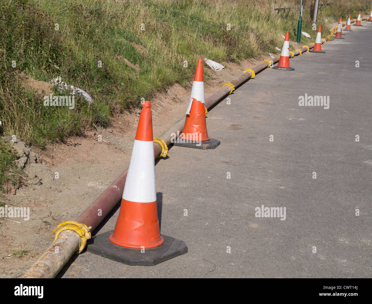 Temporary steel pipe with boltless joints laid on a road and used for ...
