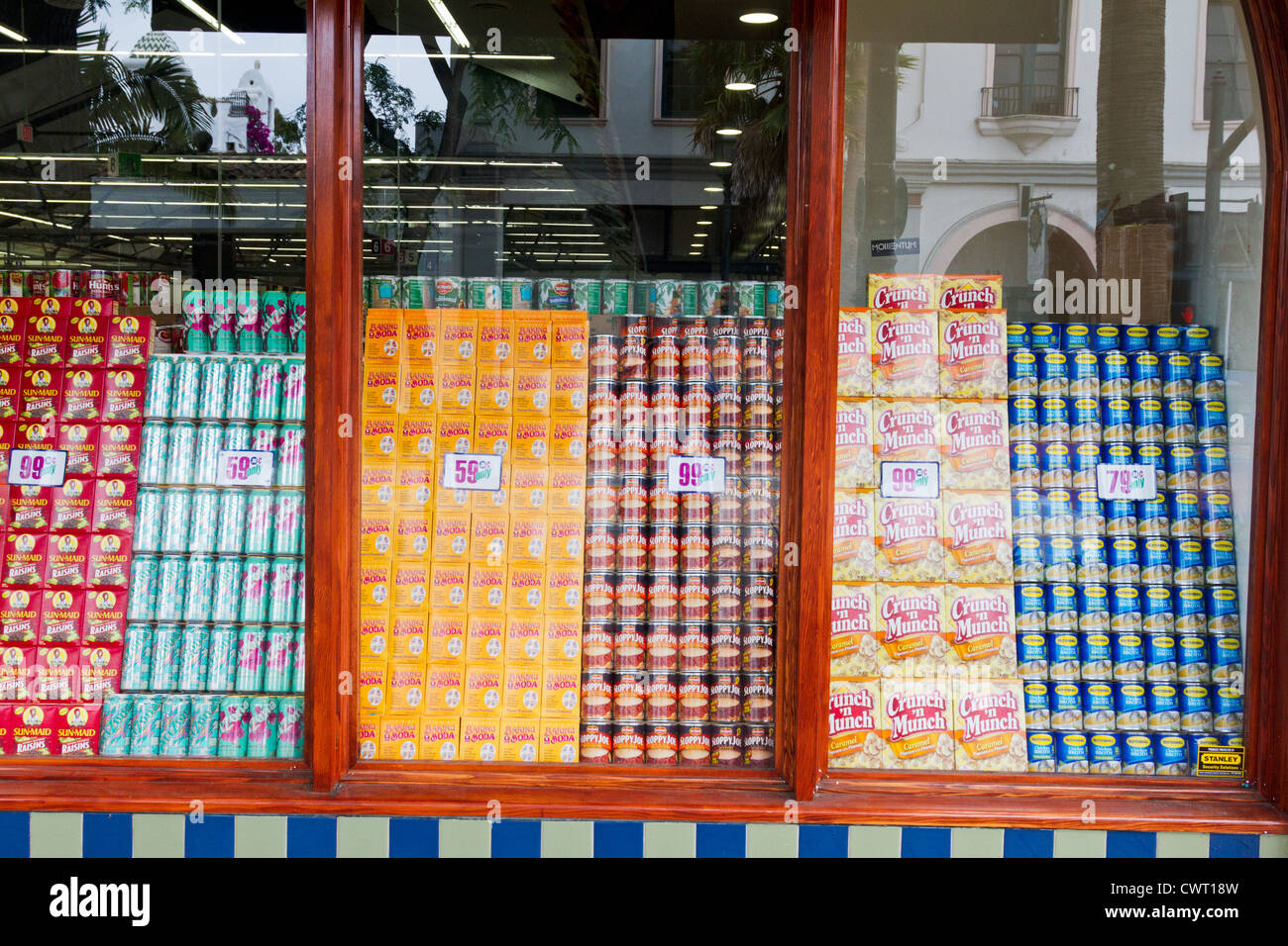 Grocery items form pattern in storefront window Stock Photo - Alamy