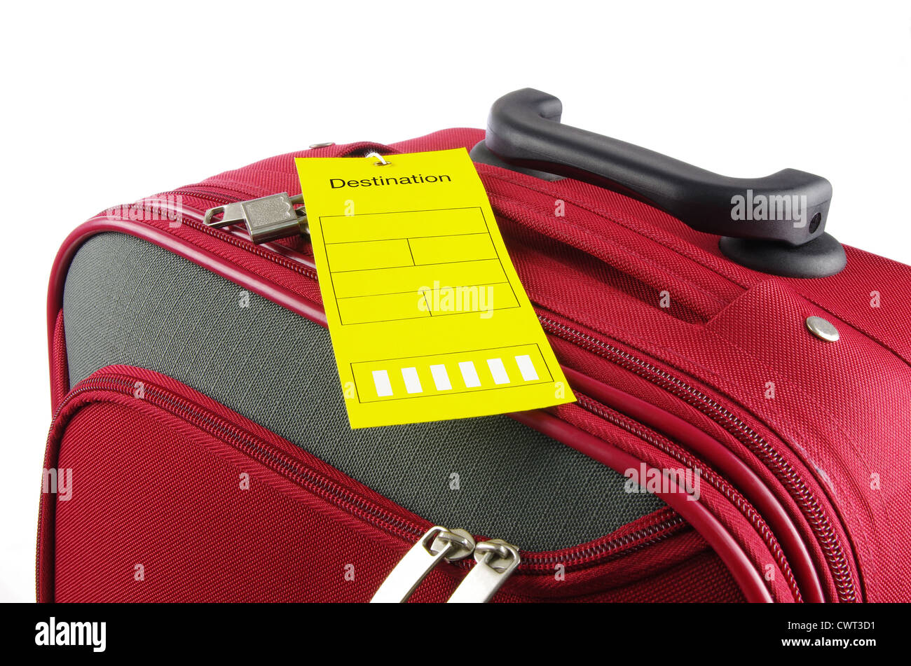 red travel bag and yellow destination label Stock Photo - Alamy