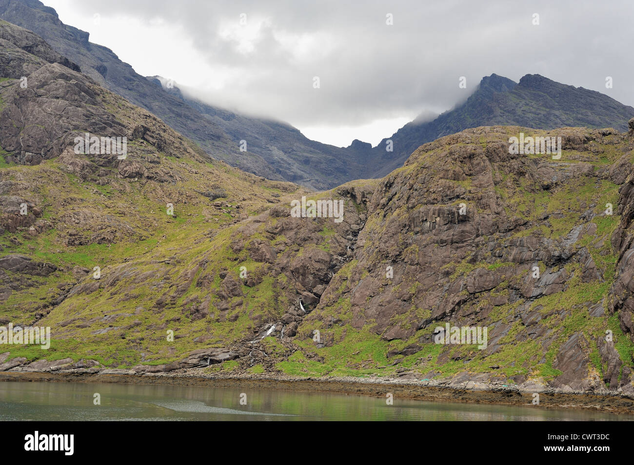 A stream runs down from mountains Stock Photo - Alamy