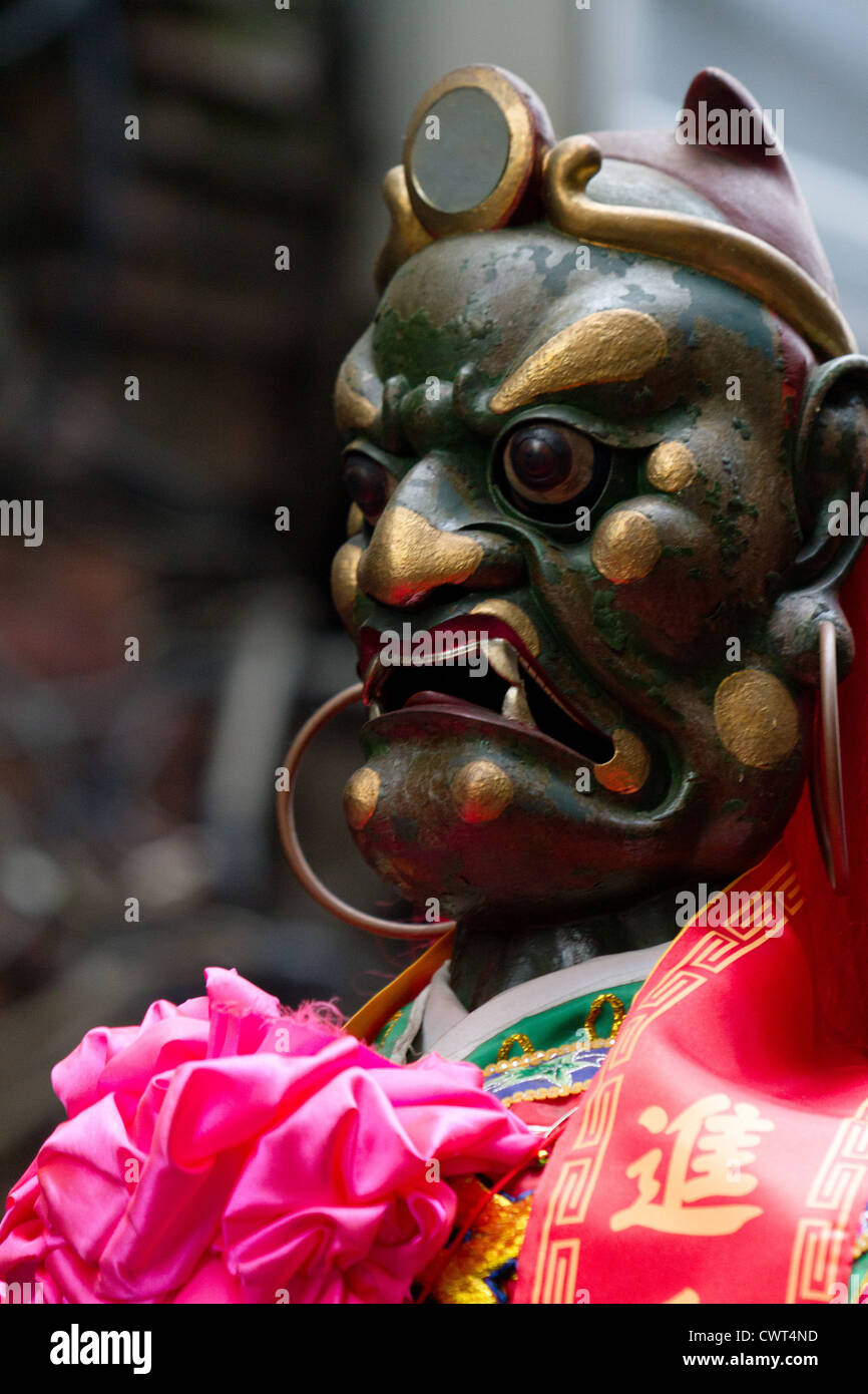 A figure of a taoist god parades through Shilin district in Taipei ...