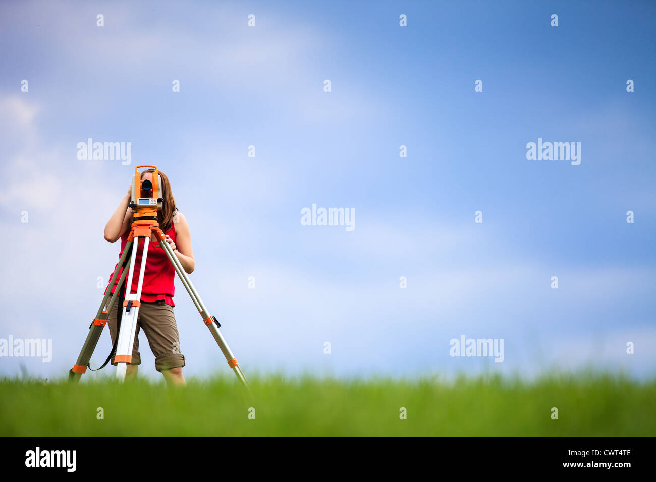 Young land surveyor at work Stock Photo - Alamy