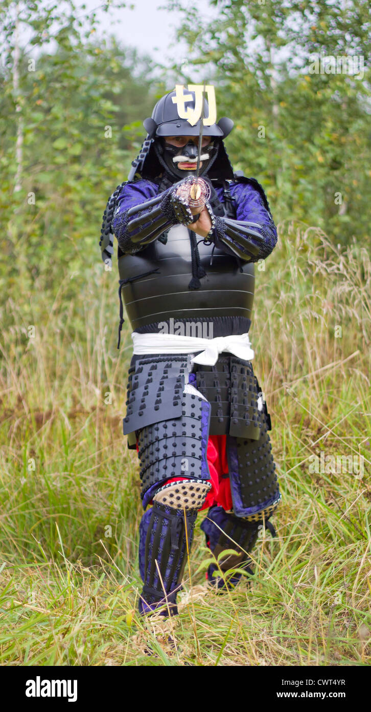 Man in Japanese medieval samurai armor (tosei-gusoku) standing in ...