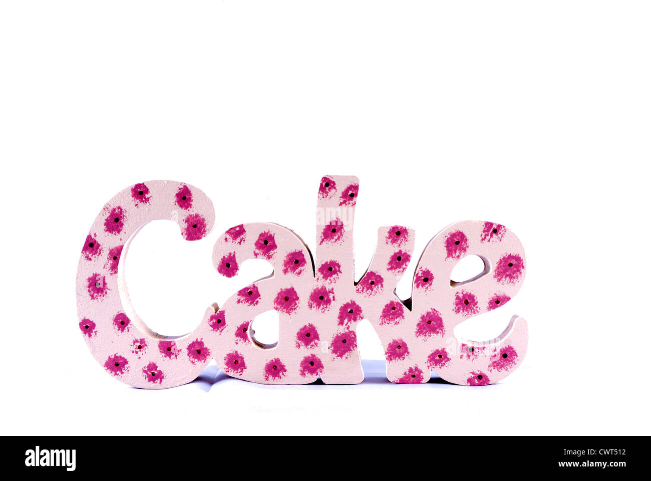 The word 'Cake' cut out of wood and decorated Stock Photo - Alamy