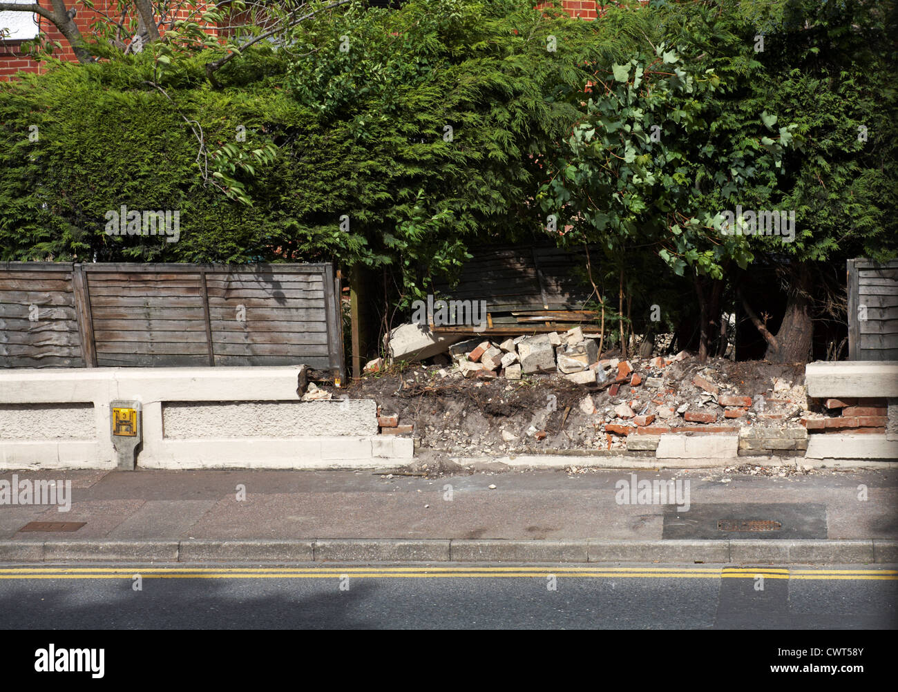 Collapsed garden wall after car lost control and drove into it at ...