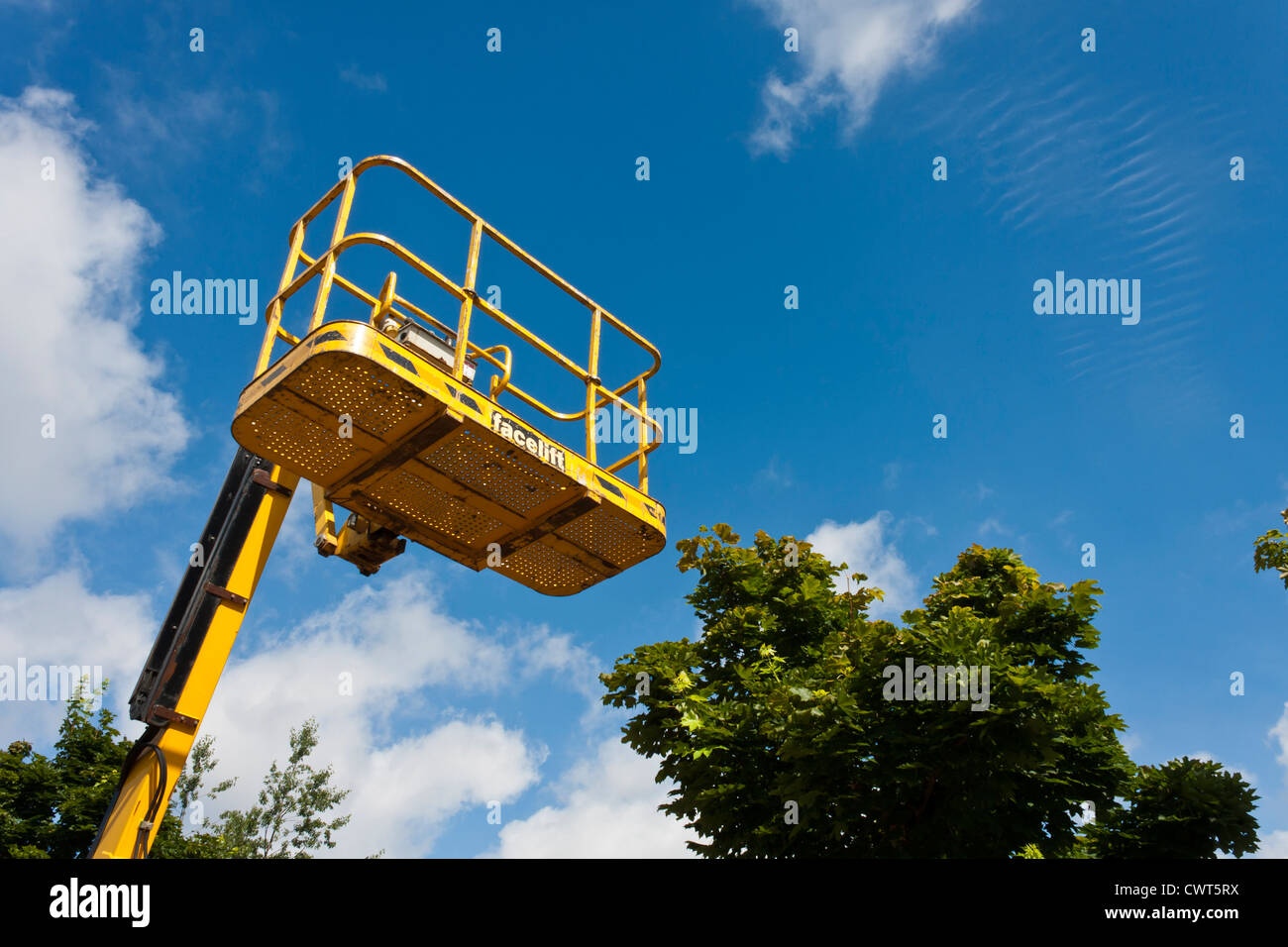 An empty cherry picker high access platform Stock Photo - Alamy