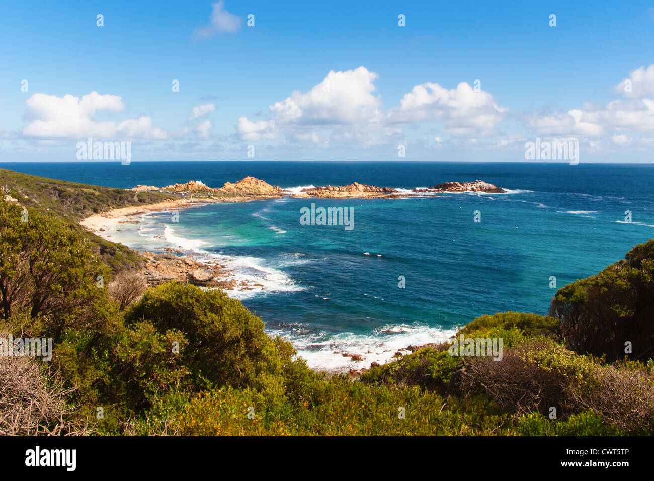 A series of rocks jut into the ocean creating a natural canal hollowed ...