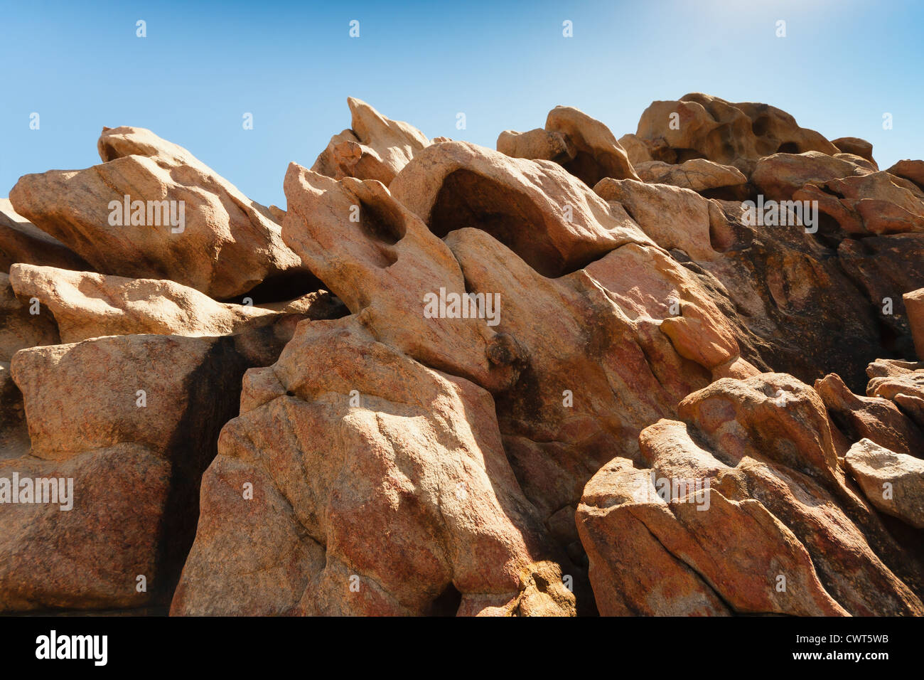 A series of rocks jut into the ocean creating a natural canal hollowed ...