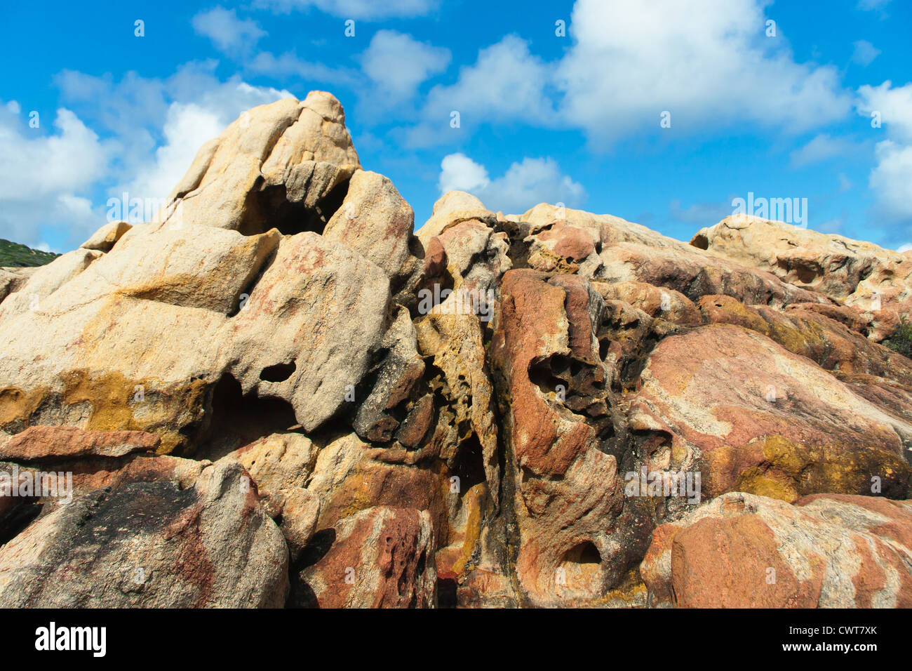 A series of rocks jut into the ocean creating a natural canal hollowed ...