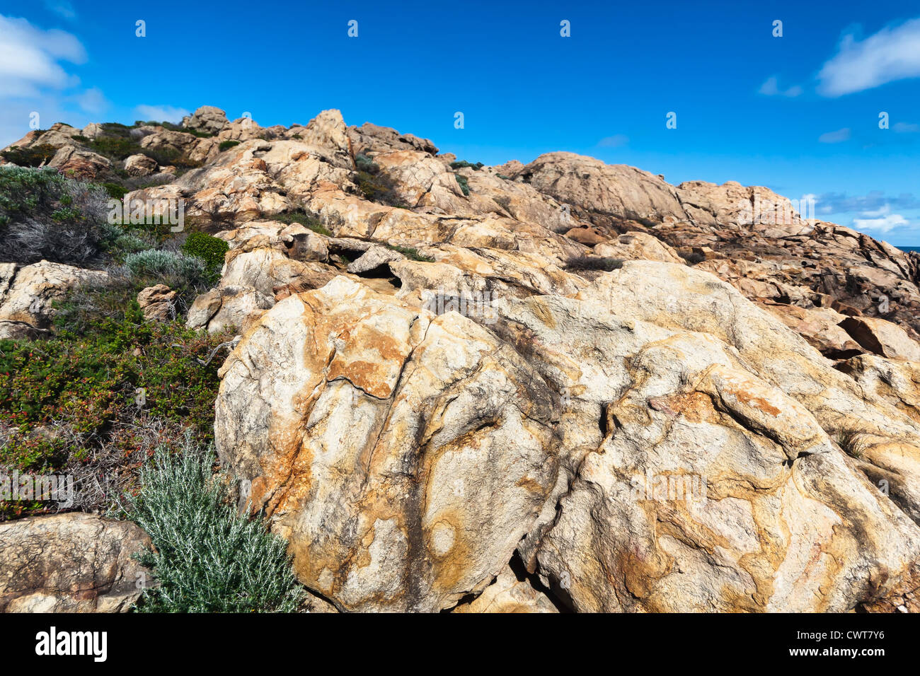 A series of rocks jut into the ocean creating a natural canal hollowed ...