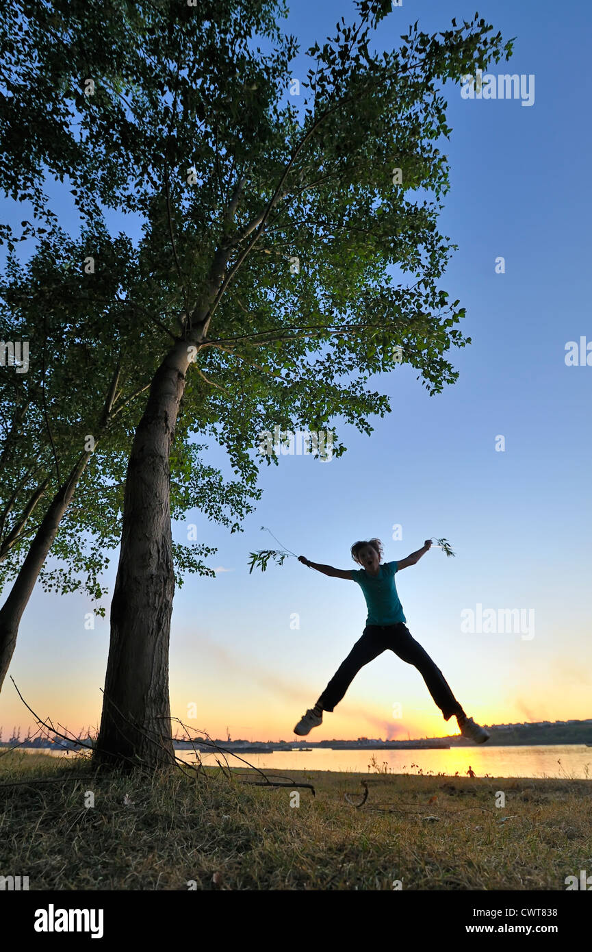 Young little girl jumping joy hi-res stock photography and images - Alamy