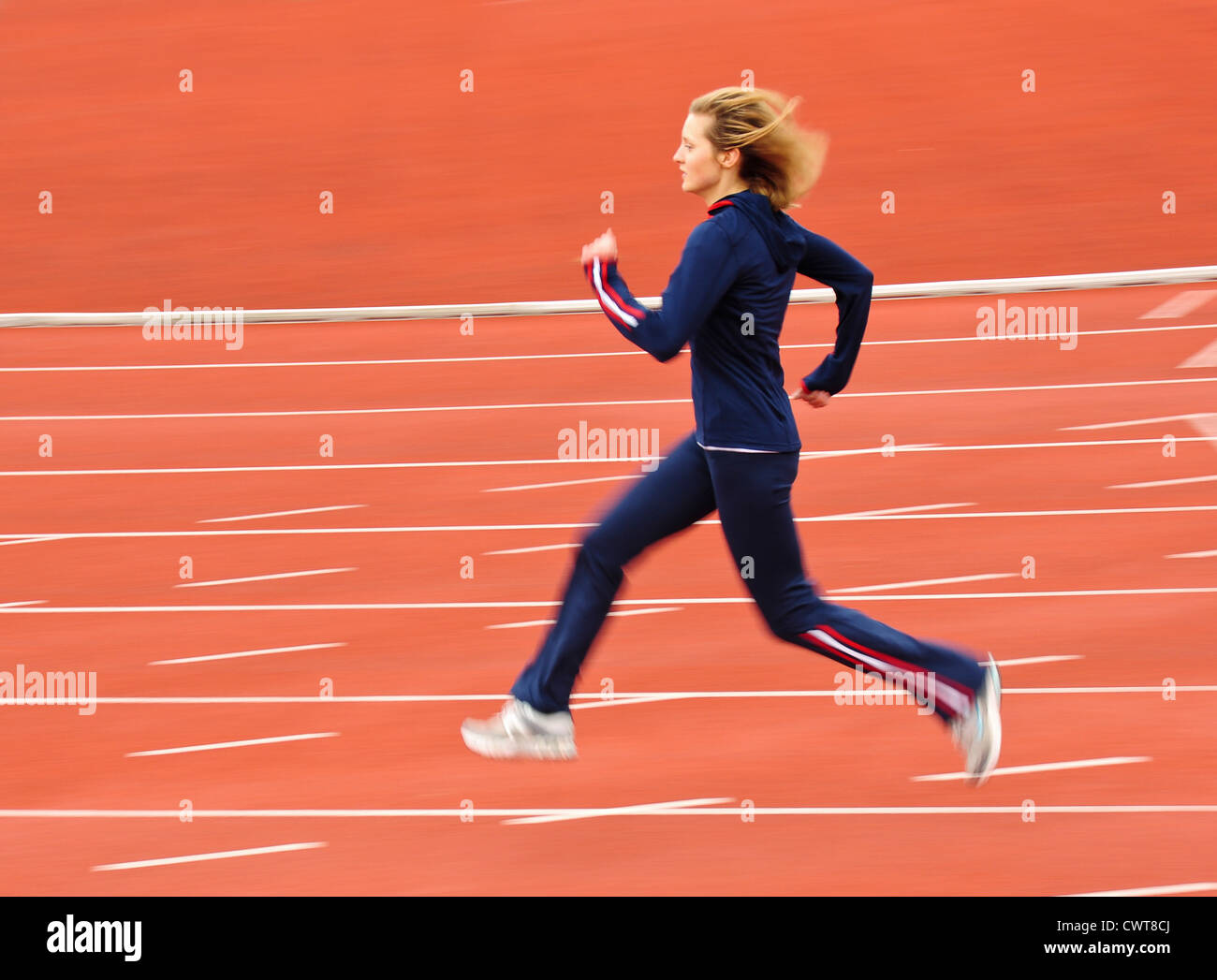 Female athlete, running on the track Stock Photo - Alamy