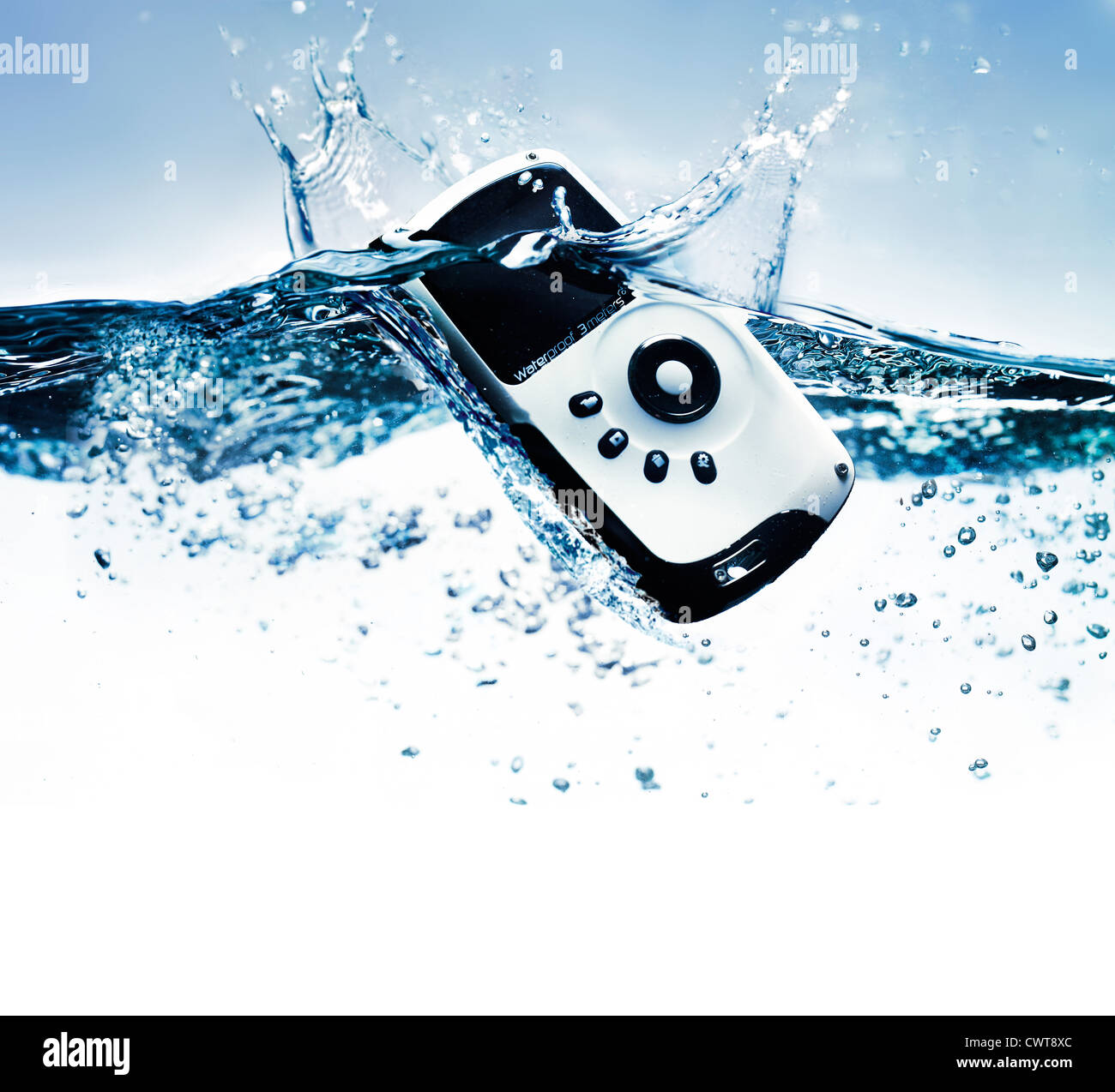 Gadget falling into water with a splash Stock Photo - Alamy